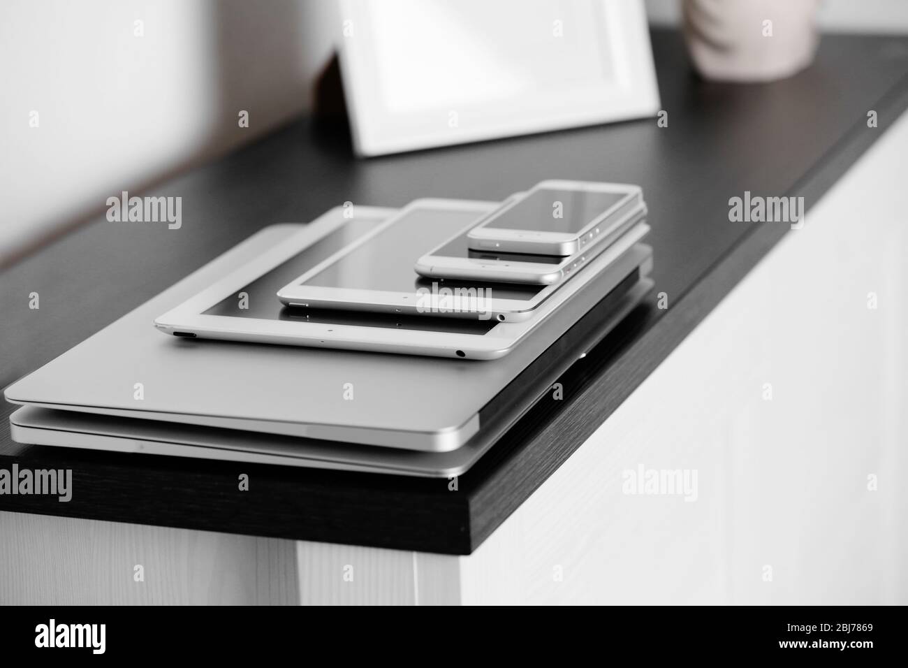 Pile of electronic gadgets on the table. Communication and technology ...