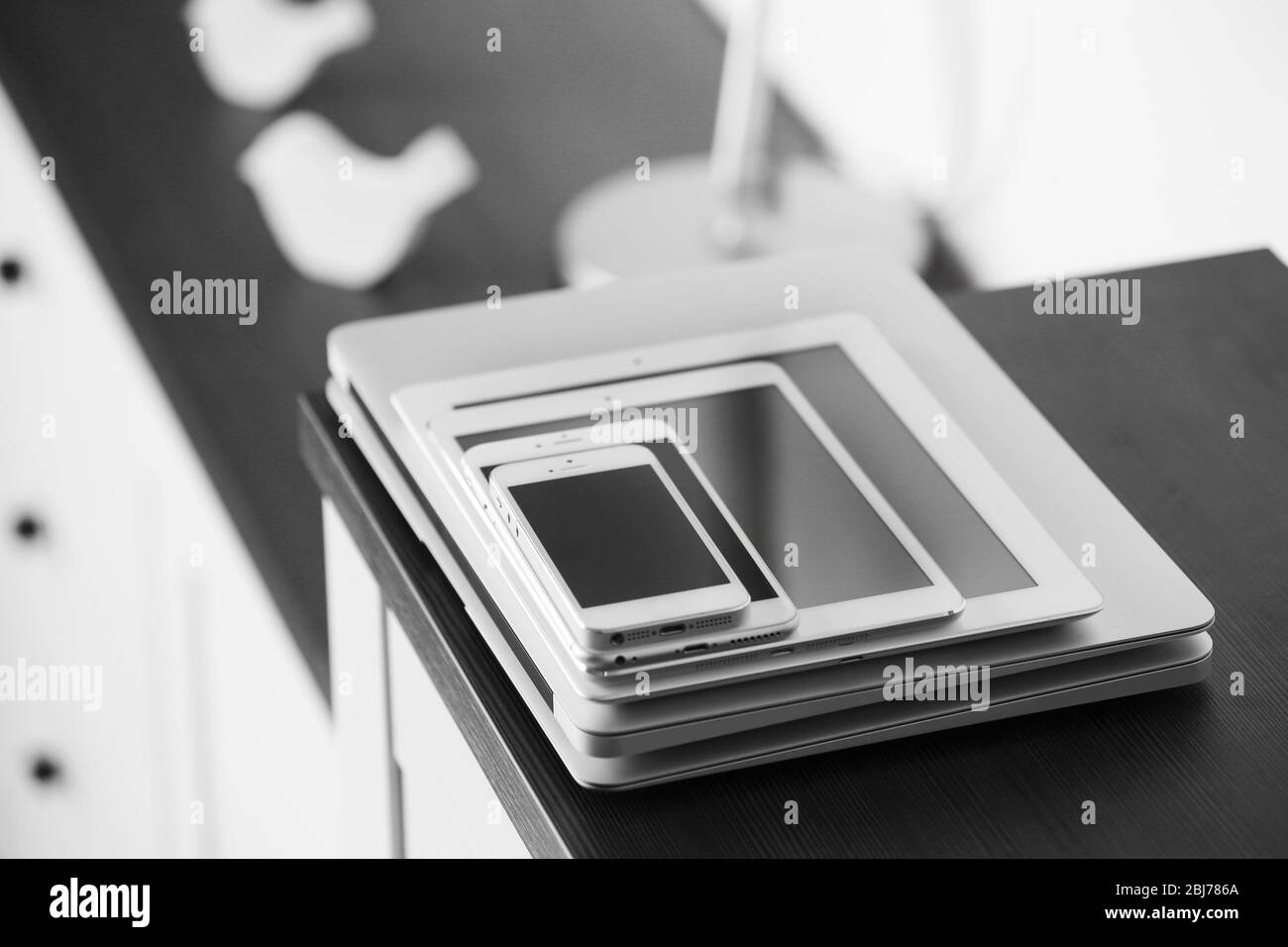 Pile of electronic gadgets on the table. Communication and technology ...