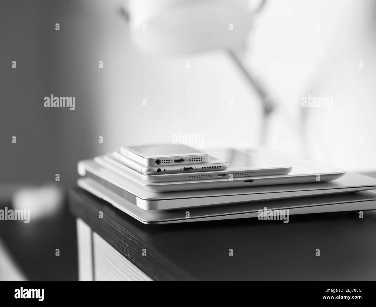 Pile of electronic gadgets on the table. Communication and technology ...