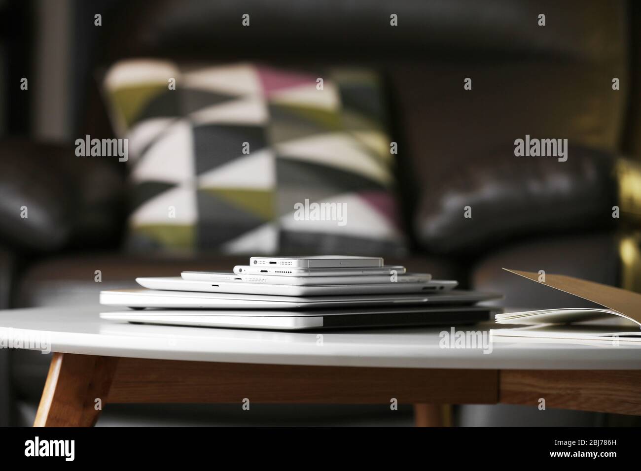 Pile of electronic gadgets on the table. Communication and technology ...