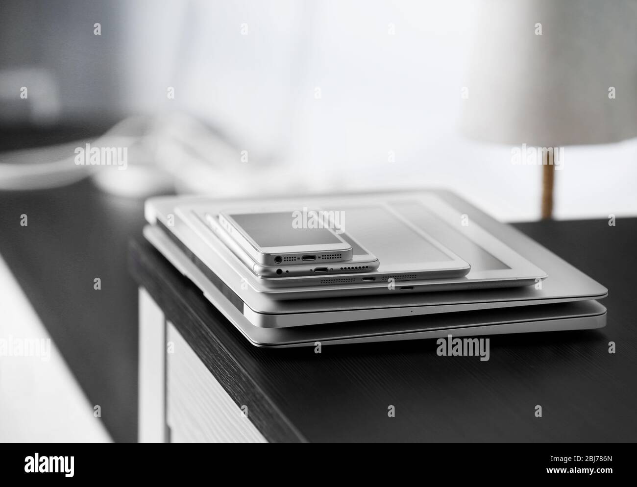 Pile of electronic gadgets on the table. Communication and technology ...