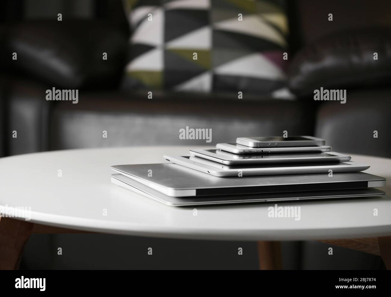 Pile of electronic gadgets on the table. Communication and technology ...