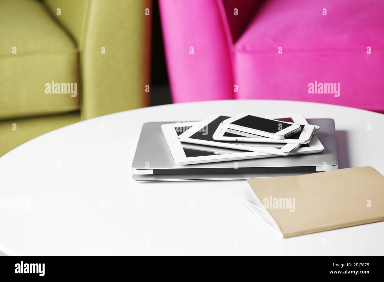 Pile of electronic gadgets on the table. Communication and technology ...