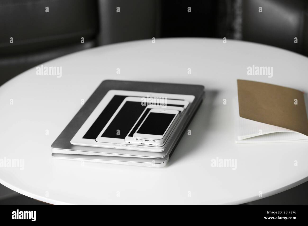 Pile of electronic gadgets on the table. Communication and technology ...