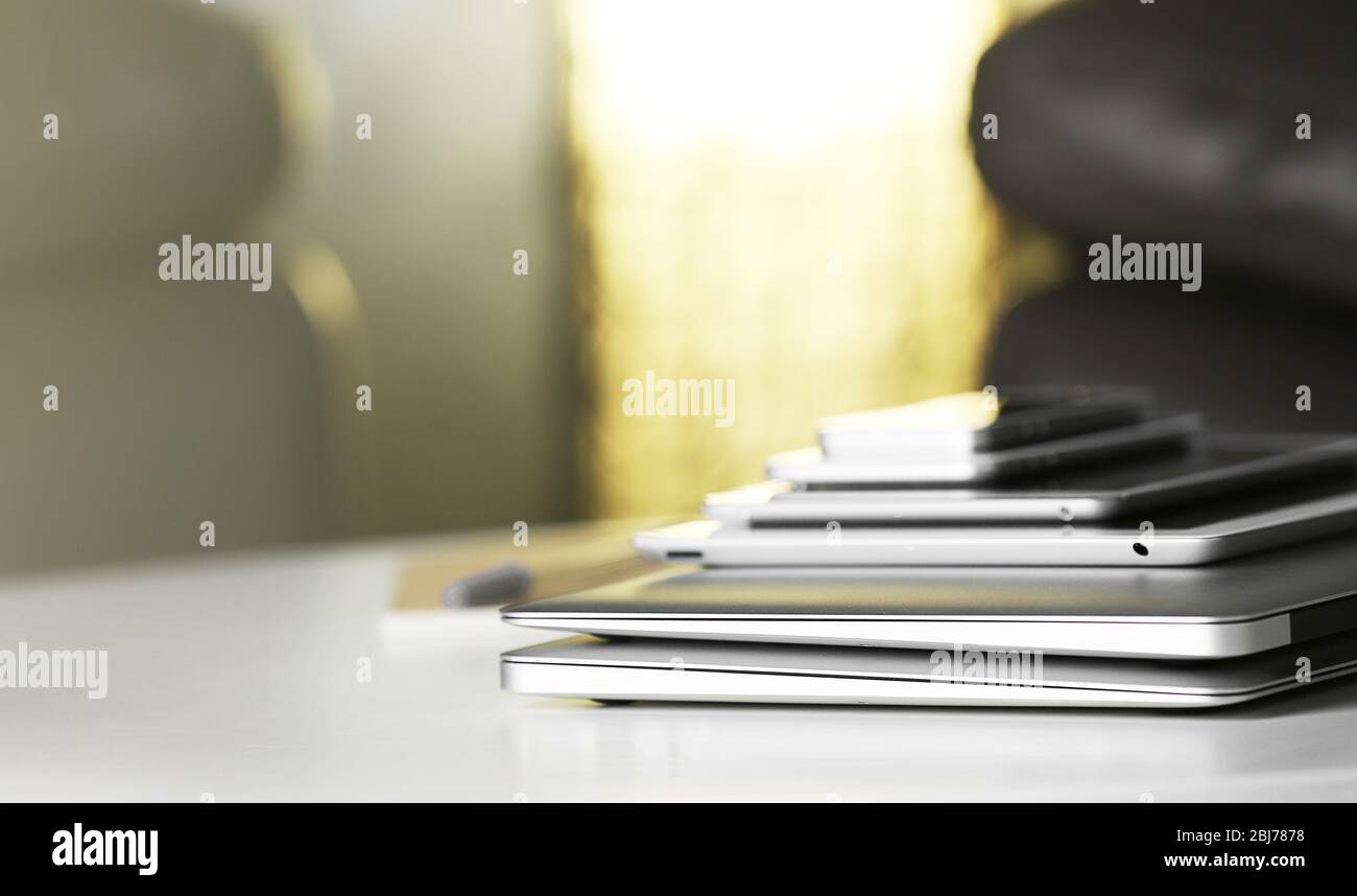 Pile of electronic gadgets on the table. Communication and technology ...