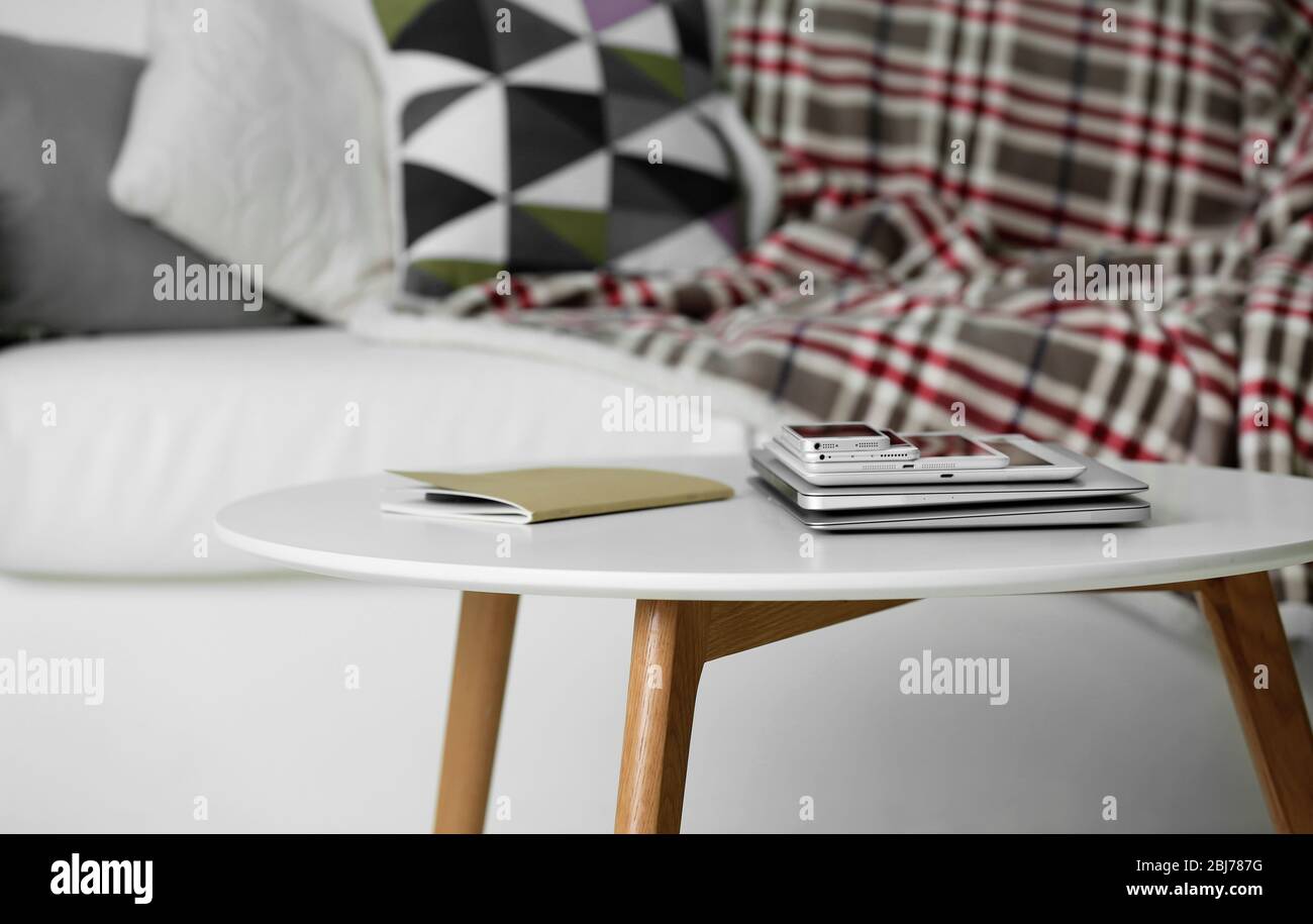 Pile of electronic gadgets on the table. Communication and technology ...