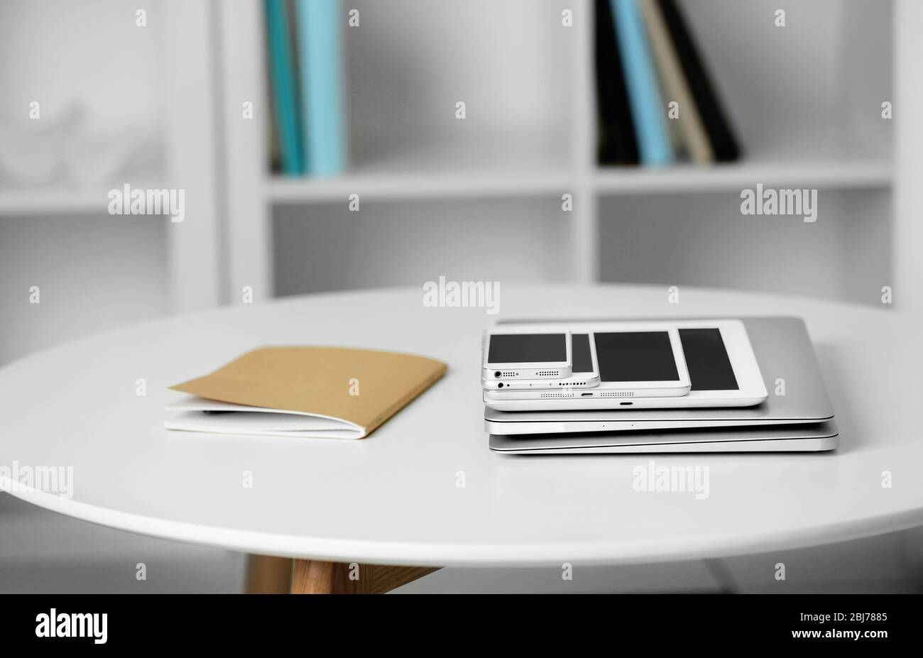 Pile of electronic gadgets on the table. Communication and technology ...