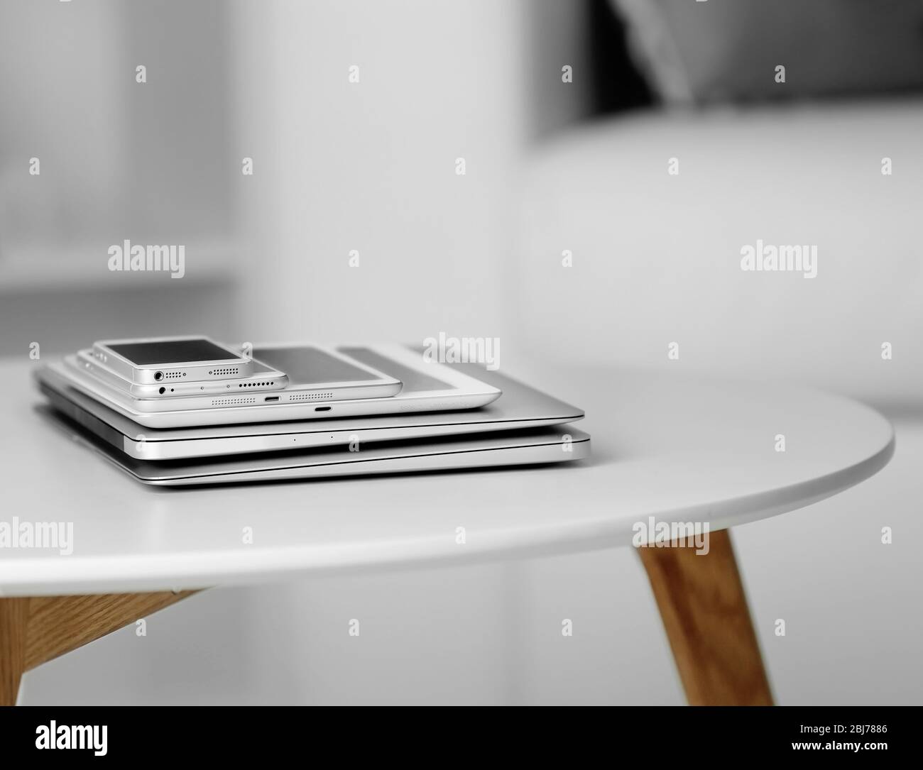 Pile of electronic gadgets on the table. Communication and technology ...