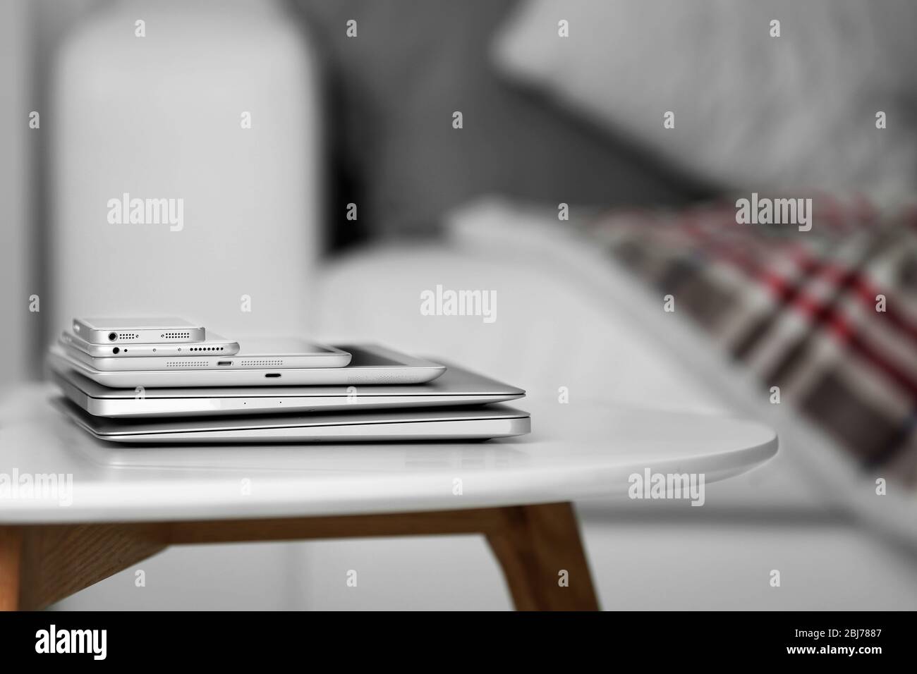Pile of electronic gadgets on the table. Communication and technology ...