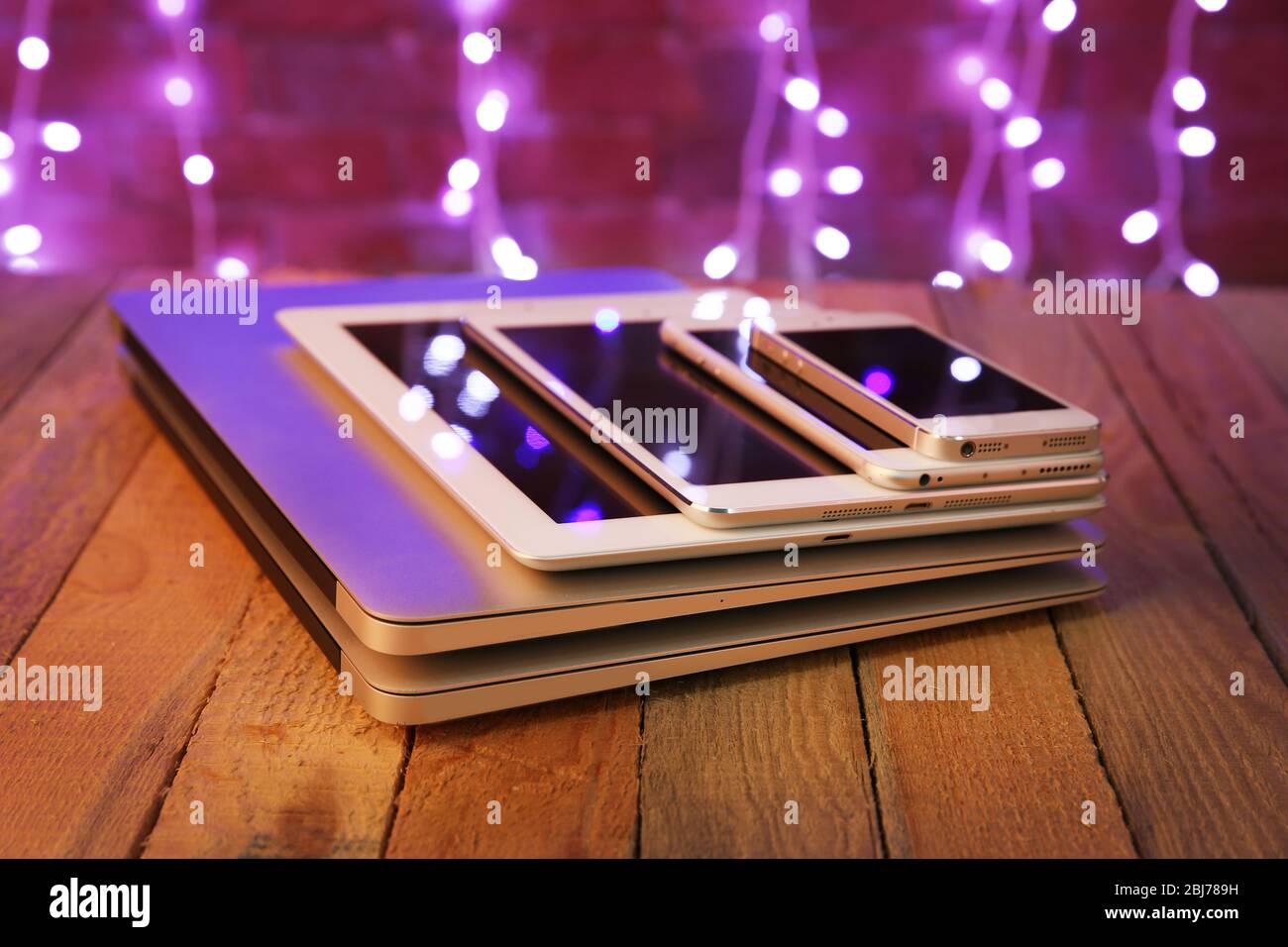 Pile of electronic gadgets on the table. Communication and technology ...