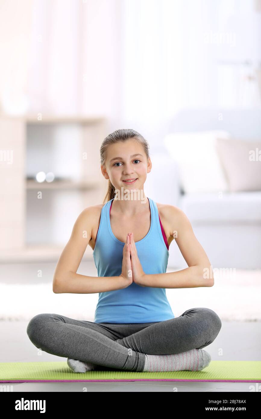 Young girl making fitness exercise indoors Stock Photo - Alamy