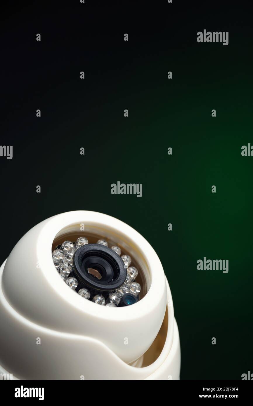 Security CCTV camera on green background, closeup Stock Photo - Alamy