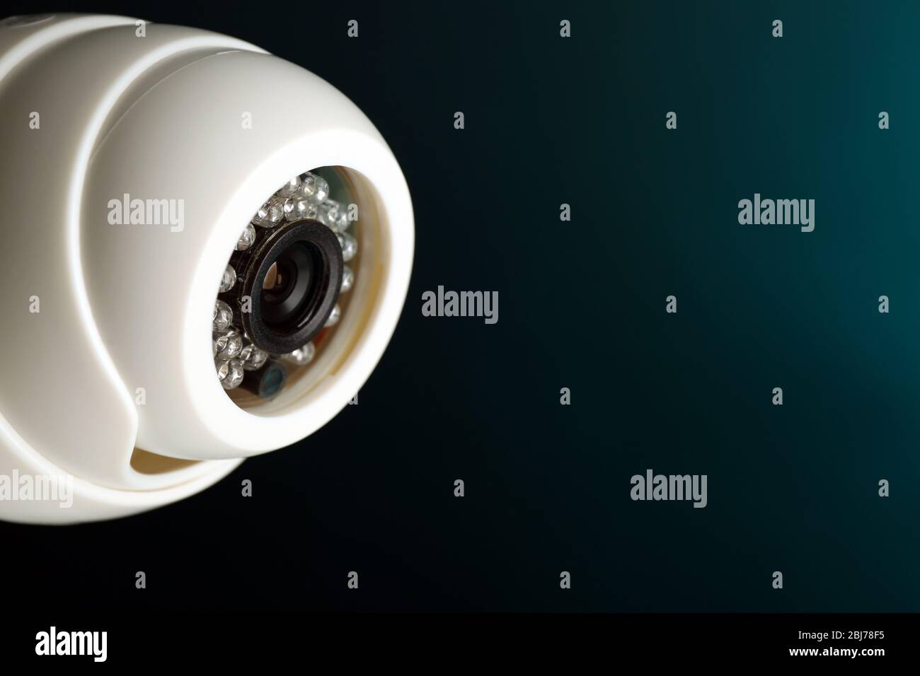 Security CCTV camera on blue background, closeup Stock Photo - Alamy