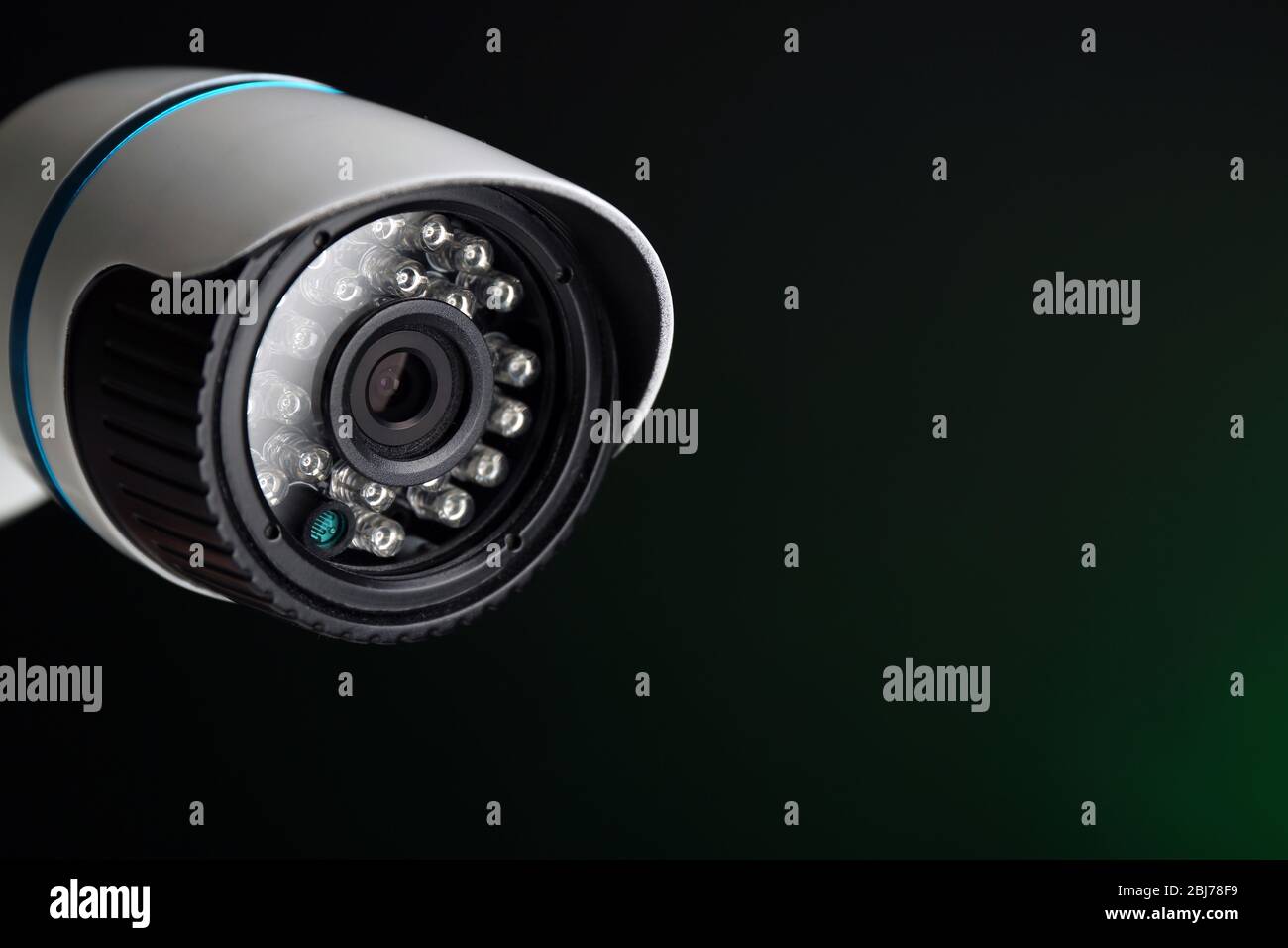 Security CCTV camera on green background, closeup Stock Photo - Alamy
