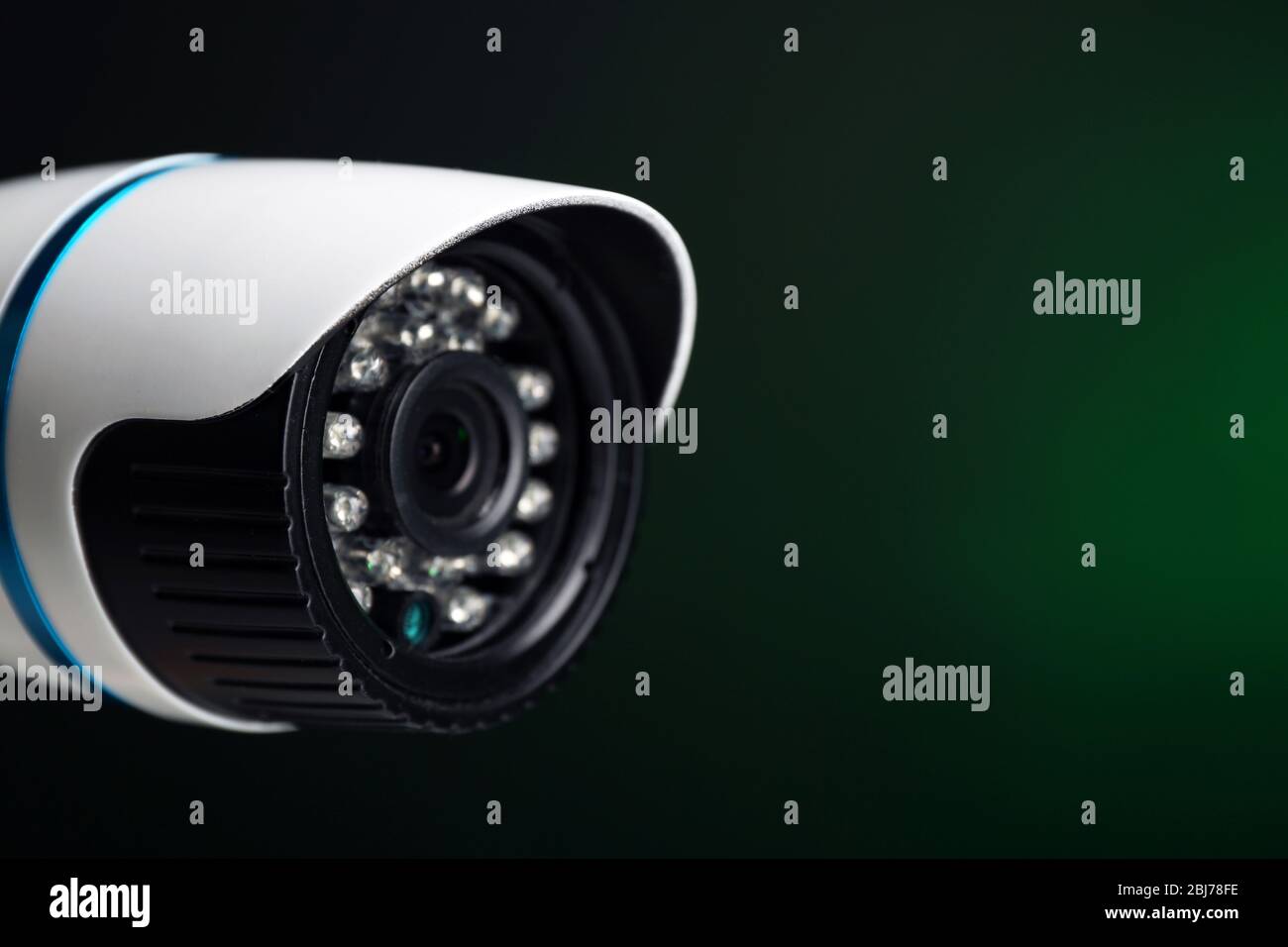 Security CCTV camera on green background, closeup Stock Photo - Alamy