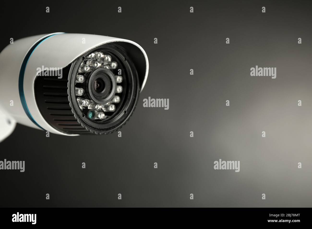 Security CCTV camera on grey background, closeup Stock Photo - Alamy