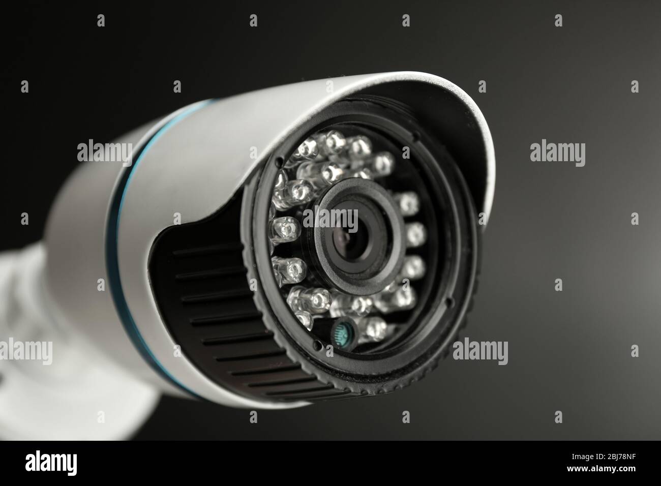 Security CCTV camera on grey background, closeup Stock Photo - Alamy