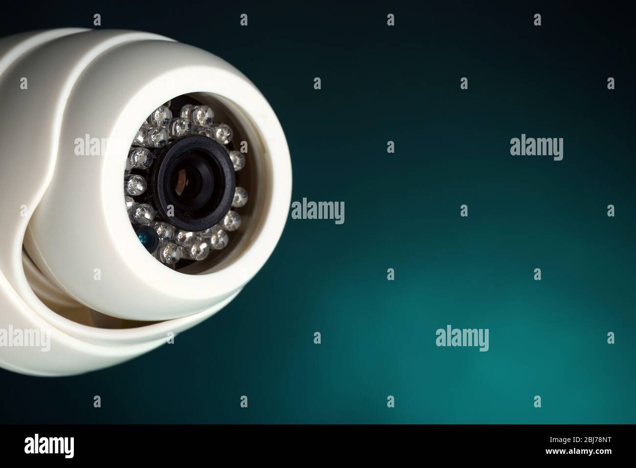 Security CCTV camera on blue background, closeup Stock Photo - Alamy