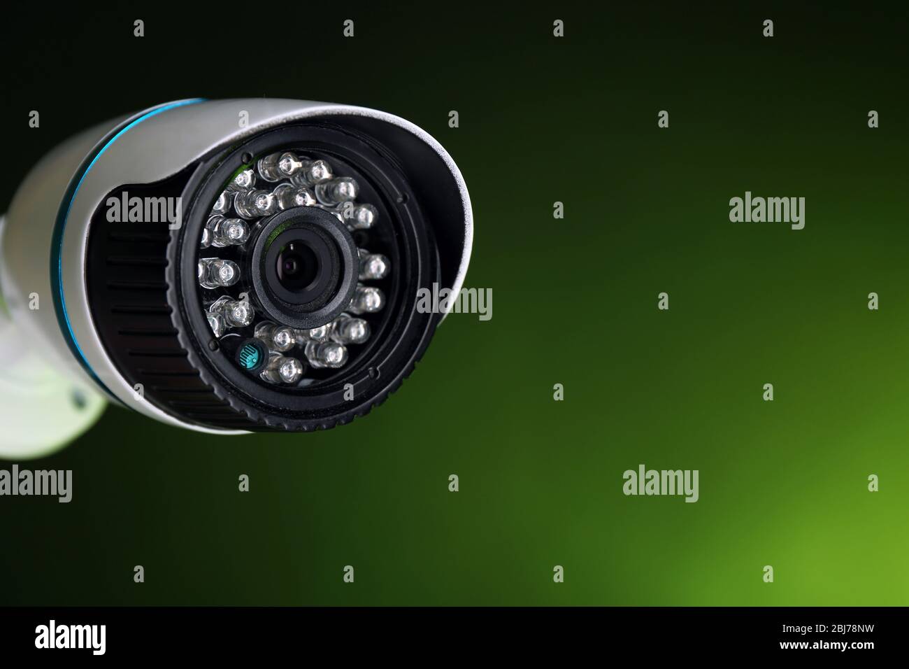Security CCTV camera on green background, closeup Stock Photo - Alamy
