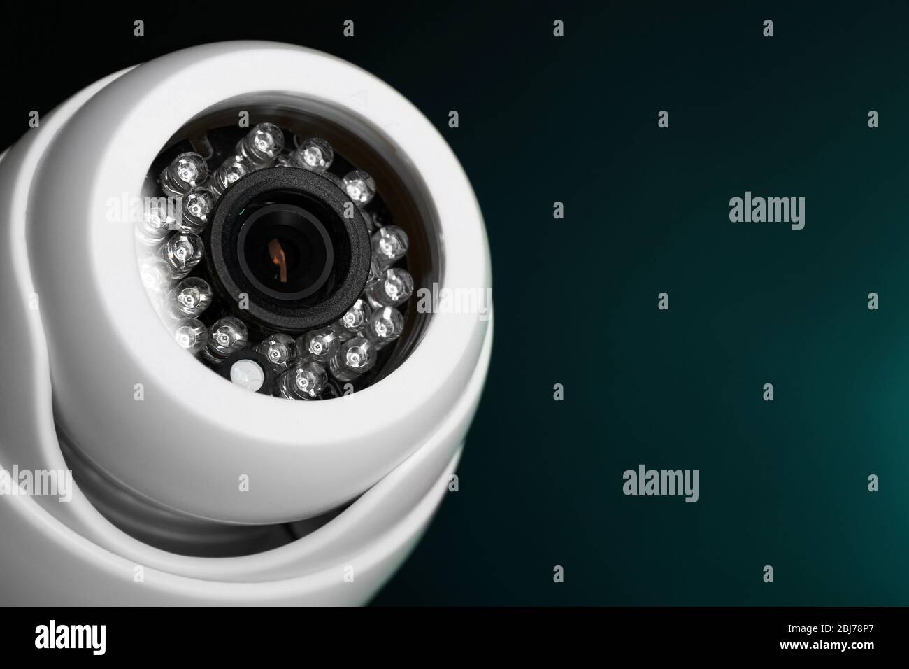 Security CCTV camera on blue background, closeup Stock Photo - Alamy