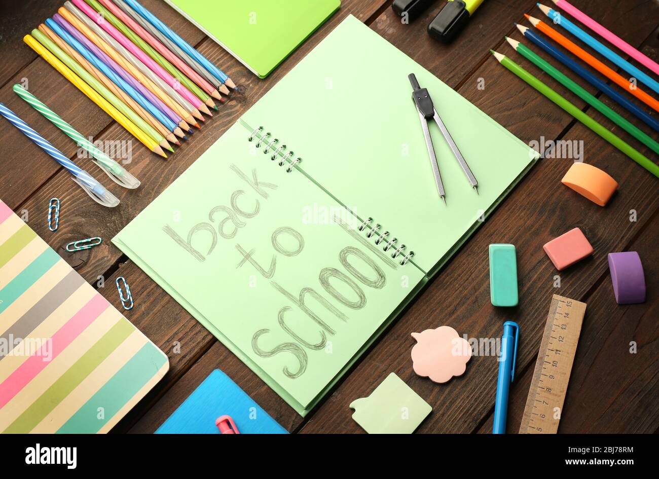 School set with back to school inscription in notebook and stationery ...