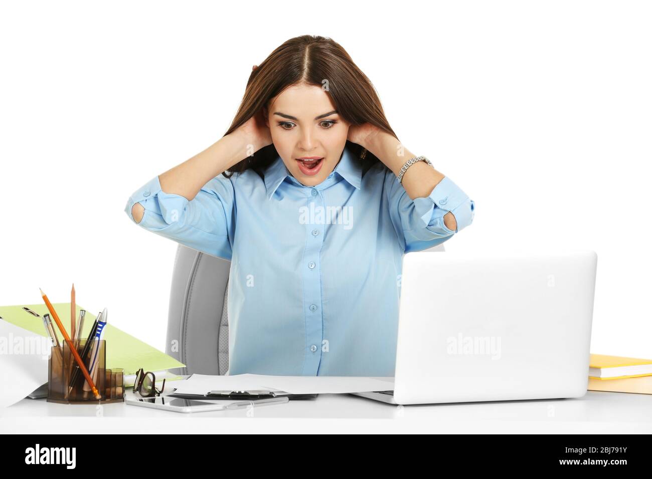 A beautiful emotional woman working at the office, isolated on white ...