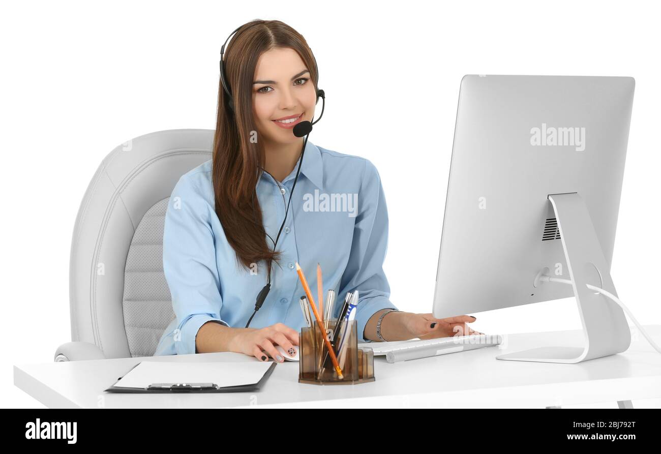 A beautiful woman with headphones and microphone working at the office ...