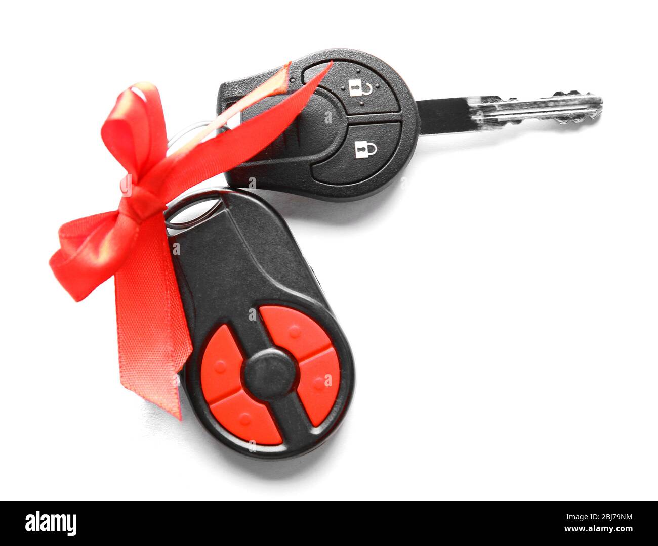 Gift car keys with red bow, isolated on white Stock Photo - Alamy