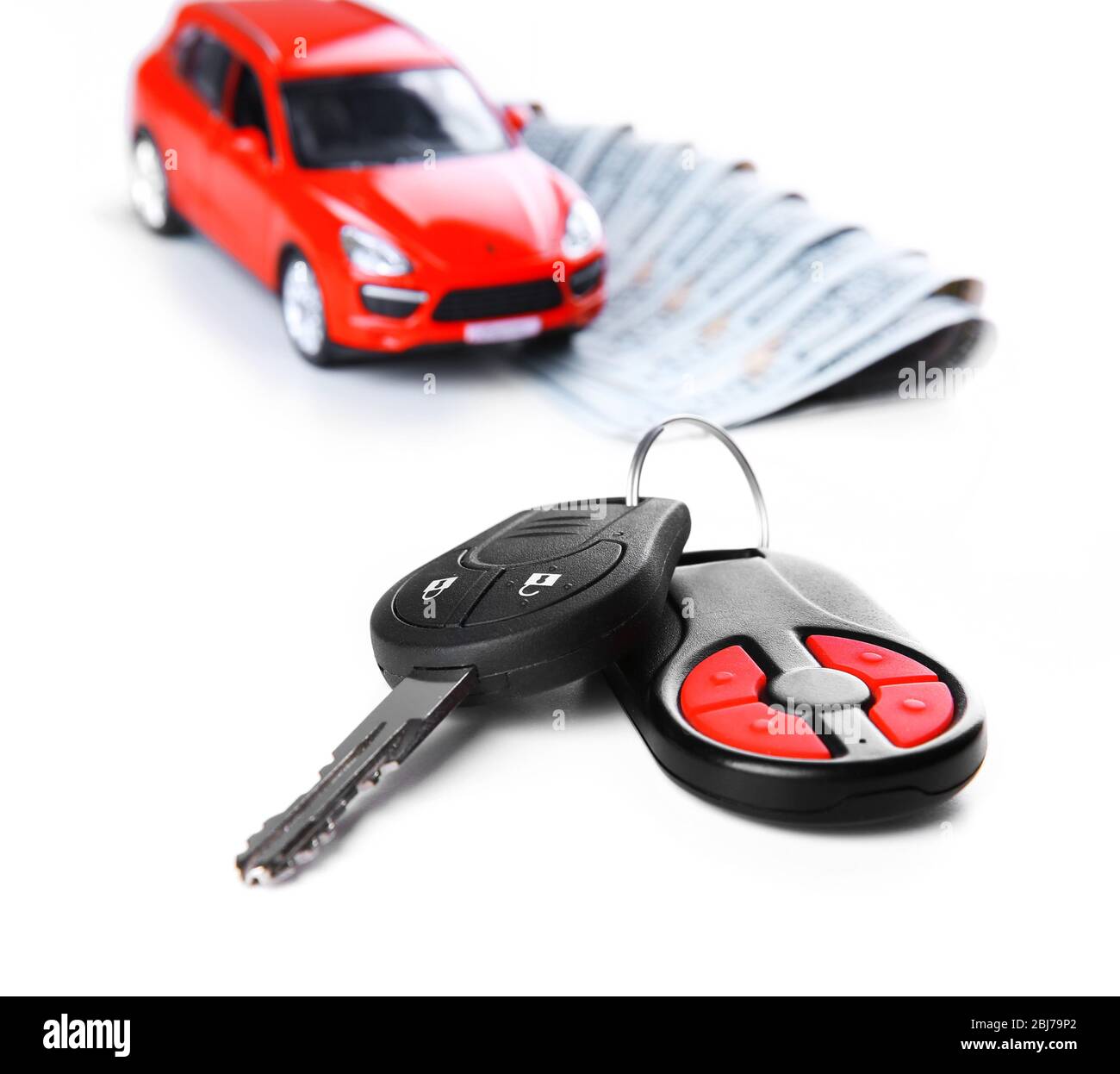 New red car with keys and dollar banknotes on white background Stock ...