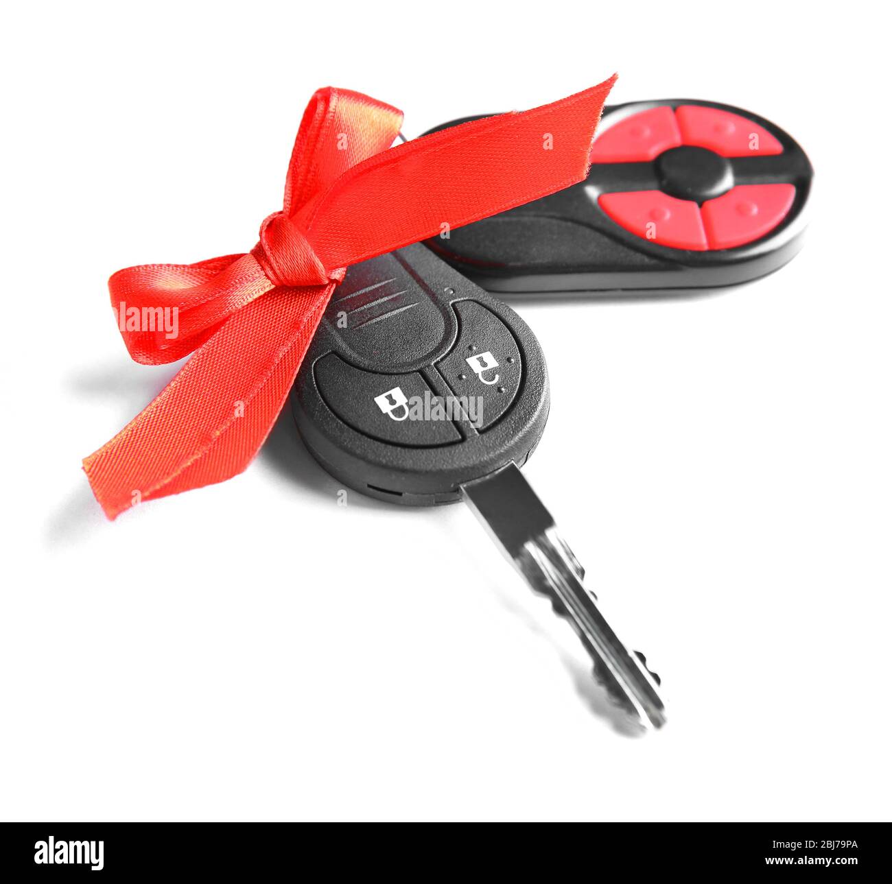 Gift car keys with red bow, isolated on white Stock Photo - Alamy