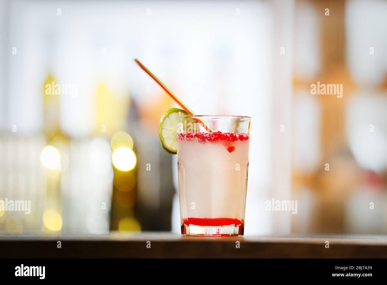 Glass of cocktail on bar background Stock Photo - Alamy