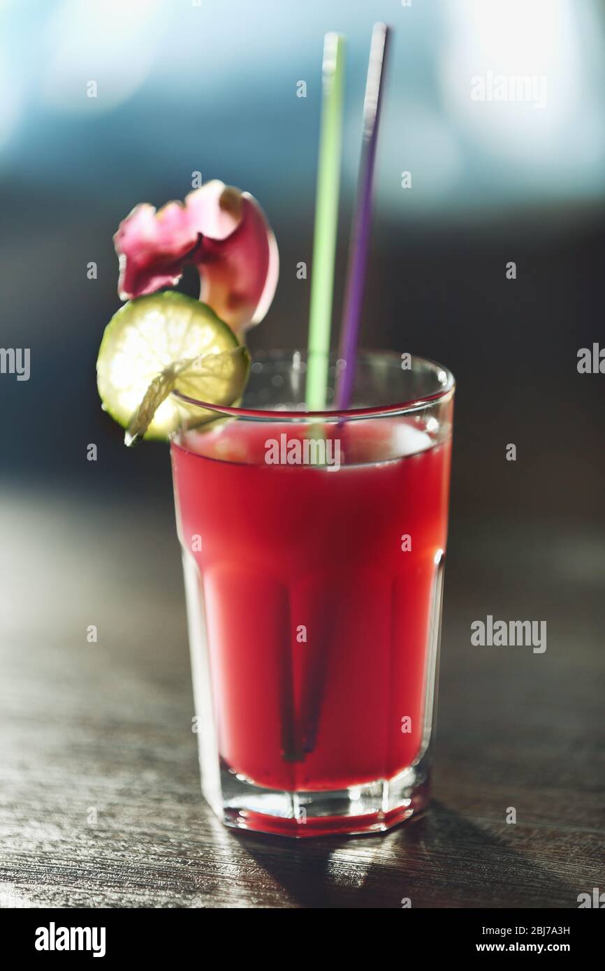 Glass of cocktail on bar background Stock Photo - Alamy