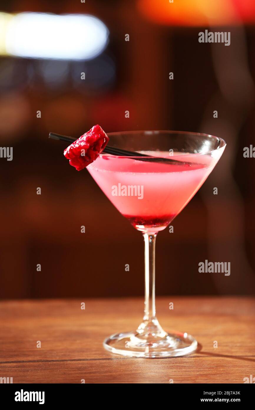 Glass of cocktail on bar background Stock Photo - Alamy