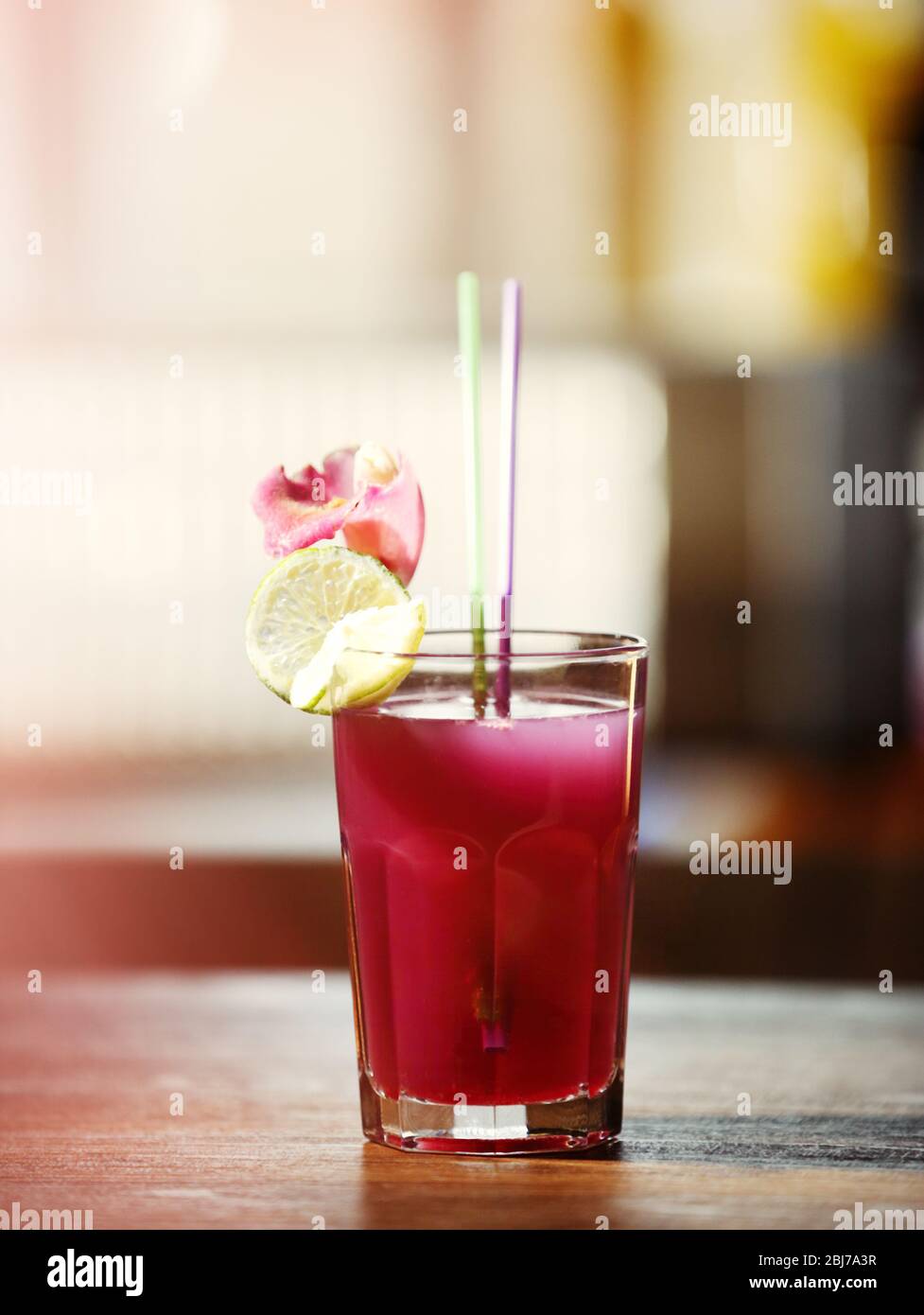 Glass of cocktail on bar background Stock Photo - Alamy