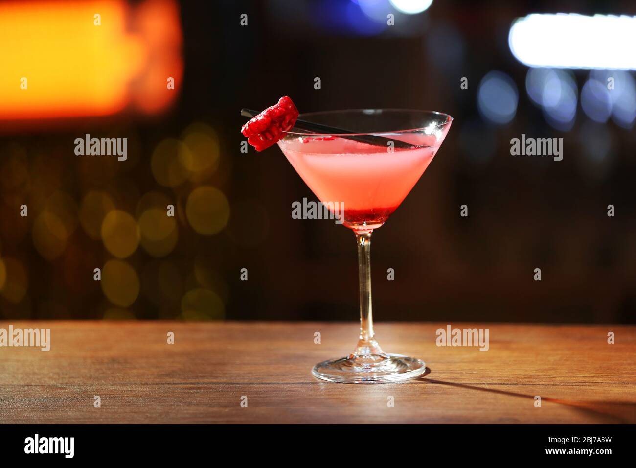 Glass of cocktail on bar background Stock Photo - Alamy