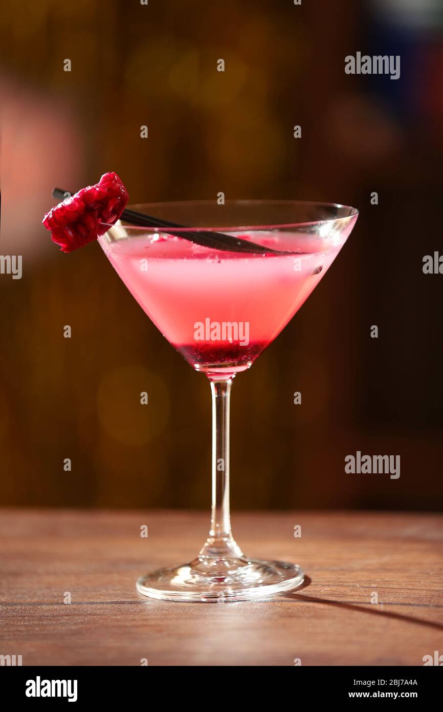 Glass of cocktail on bar background Stock Photo - Alamy