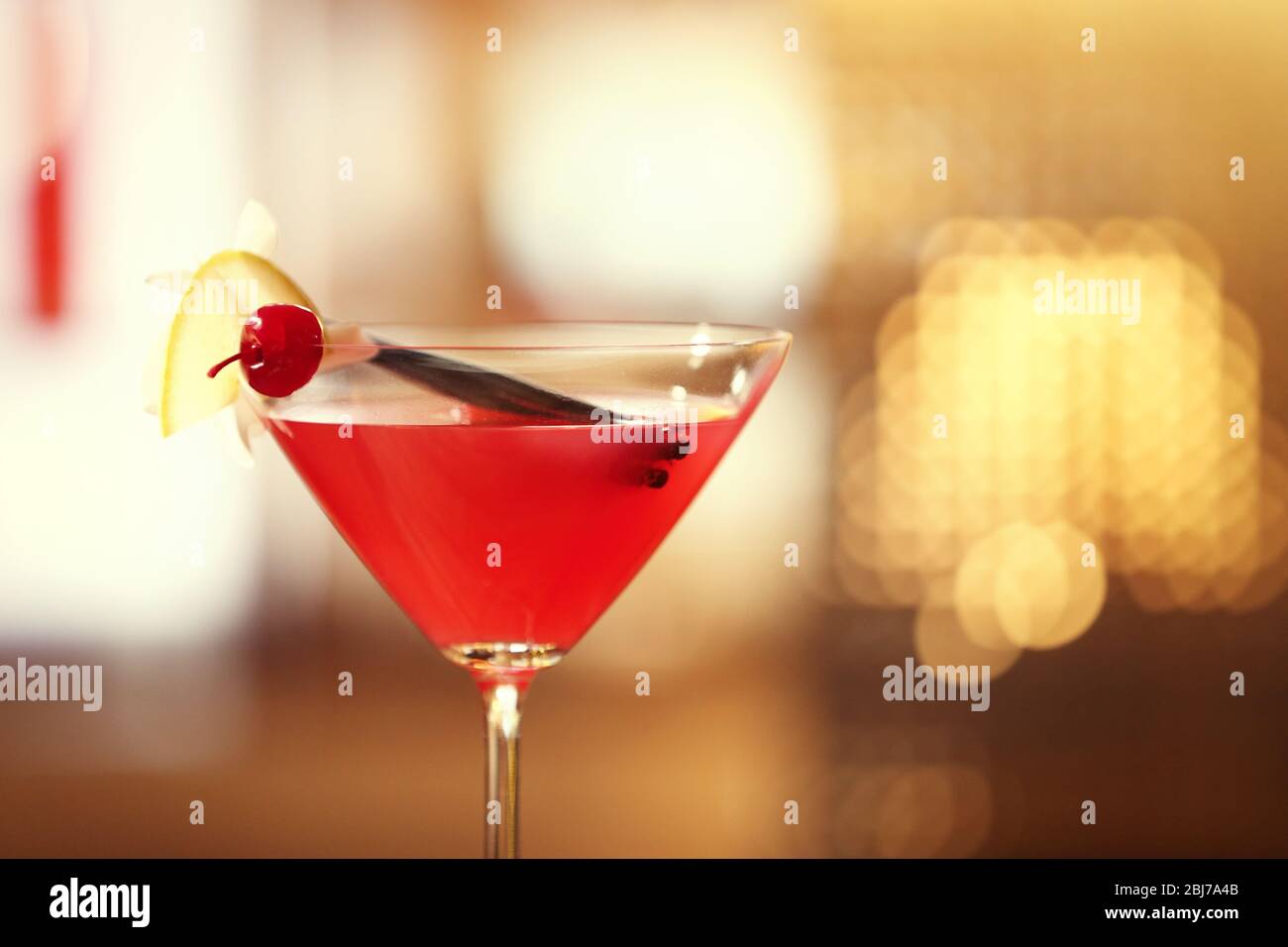 Glass of cocktail on bar background Stock Photo - Alamy