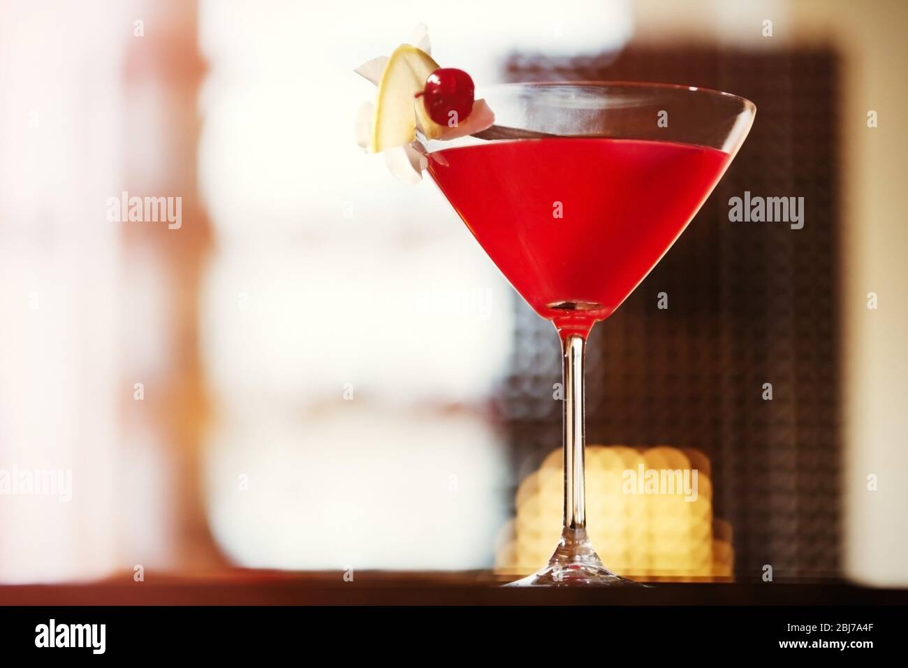 Glass of cocktail on bar background Stock Photo - Alamy
