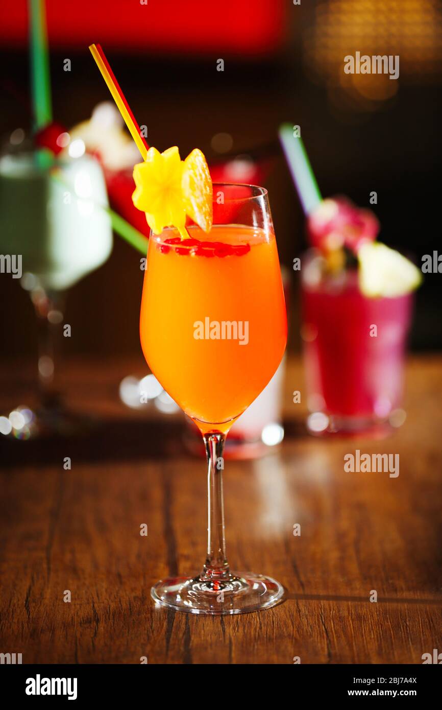 Glasses of cocktails on bar background Stock Photo - Alamy