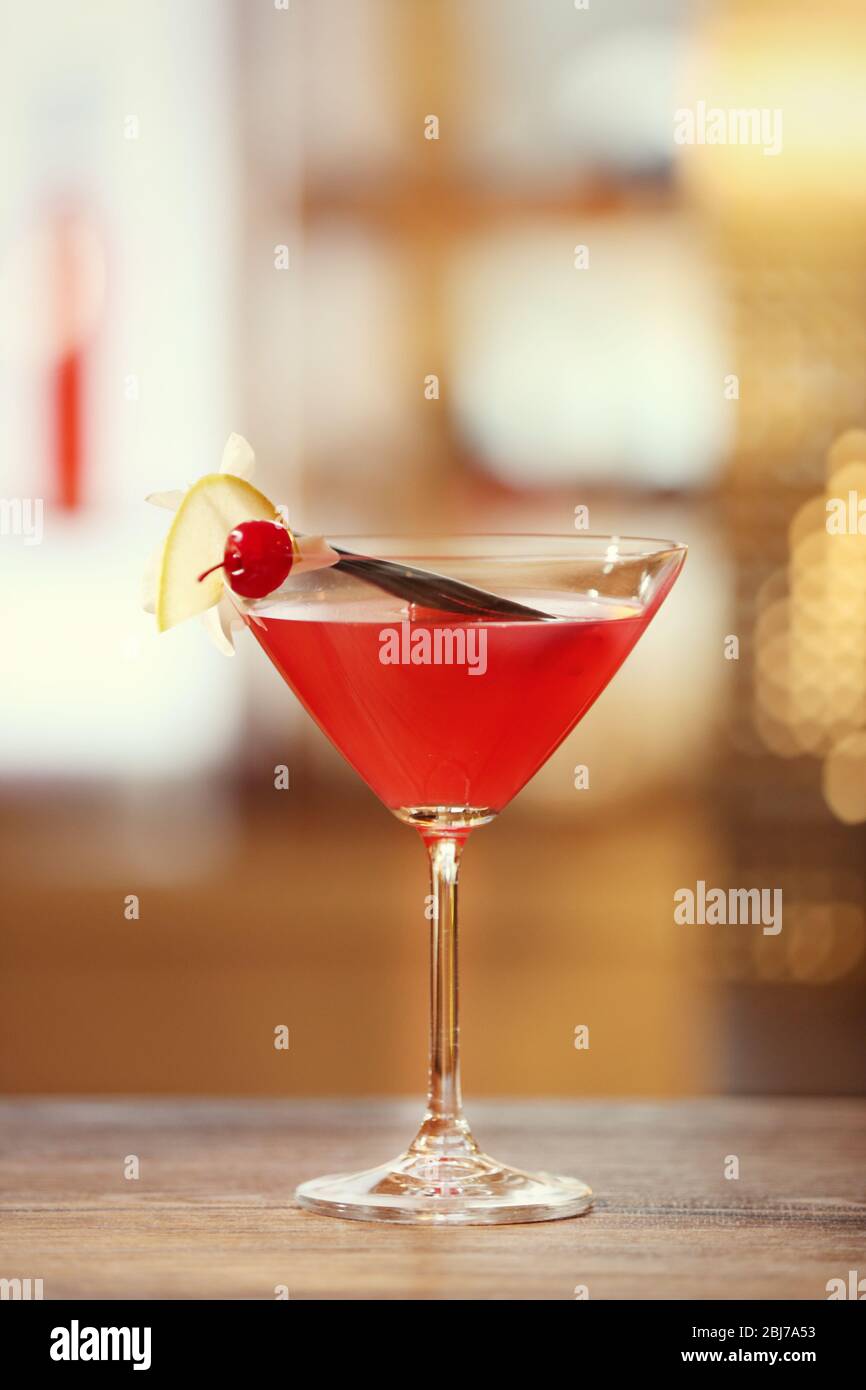 Glass of cocktail on bar background Stock Photo - Alamy