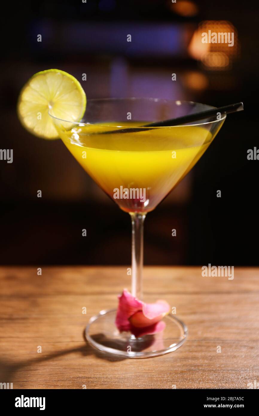 Glass of cocktail on bar background Stock Photo - Alamy