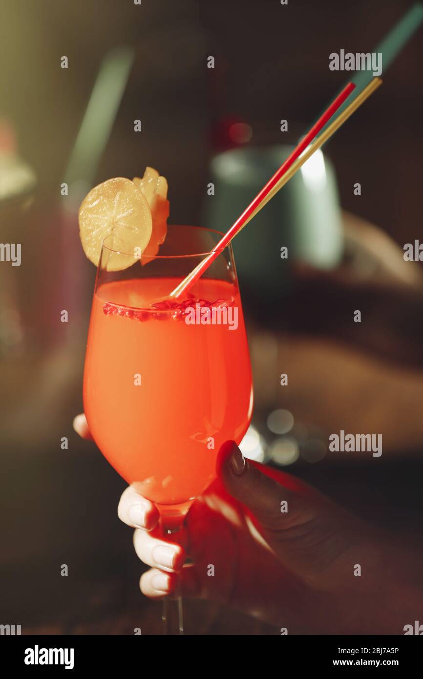 Glasses of cocktails on bar background Stock Photo - Alamy
