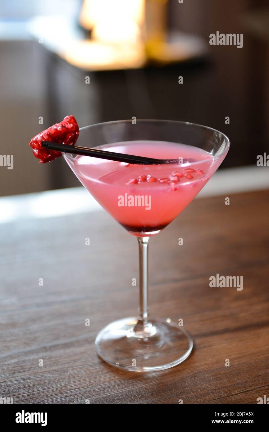 Glass of cocktail on bar background Stock Photo - Alamy