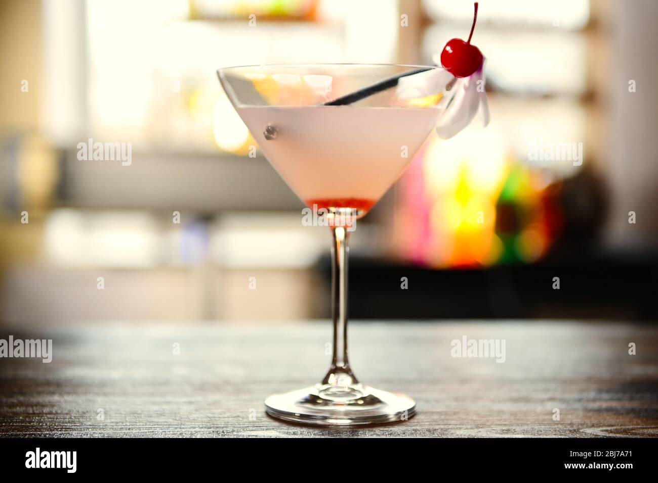 Glass of cocktail on bar background Stock Photo - Alamy