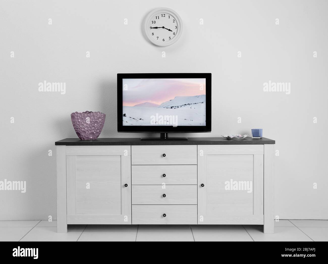 TV set in the interior of light room Stock Photo - Alamy