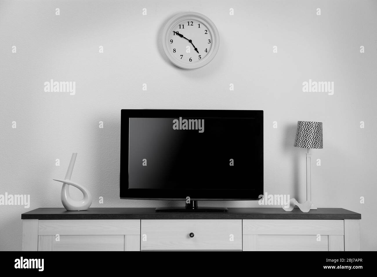 TV set in the interior of light room Stock Photo - Alamy