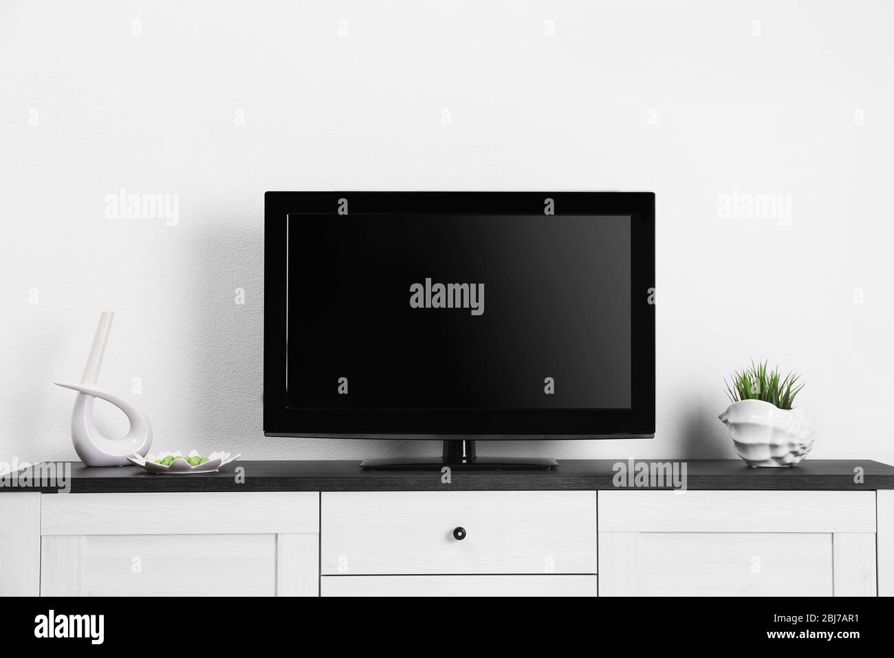 TV set in the interior of light room Stock Photo - Alamy