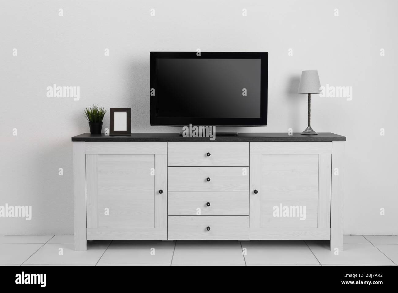 TV set in the interior of light room Stock Photo - Alamy