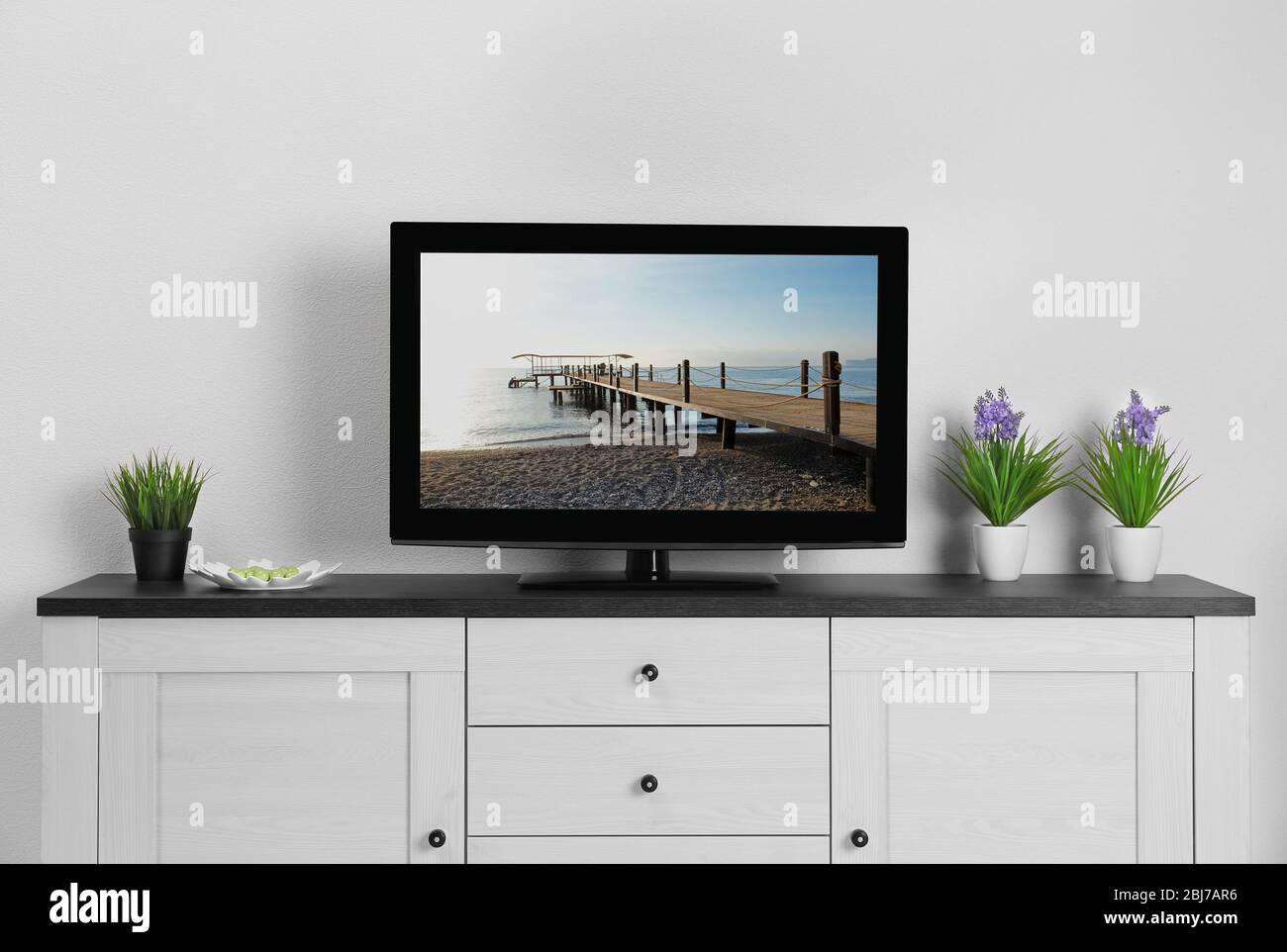 TV set in the interior of light room Stock Photo - Alamy