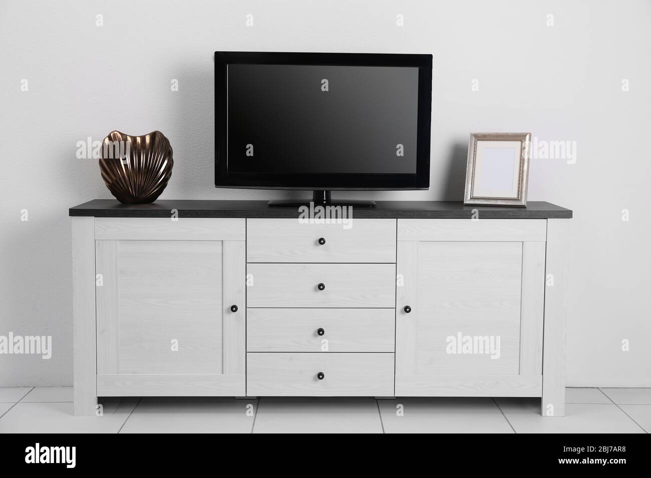 TV set in the interior of light room Stock Photo - Alamy